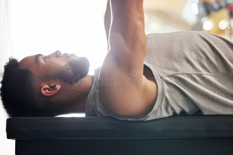Bench Press Over Sofas Any Day. a Young Man Working Out with a Bench ...