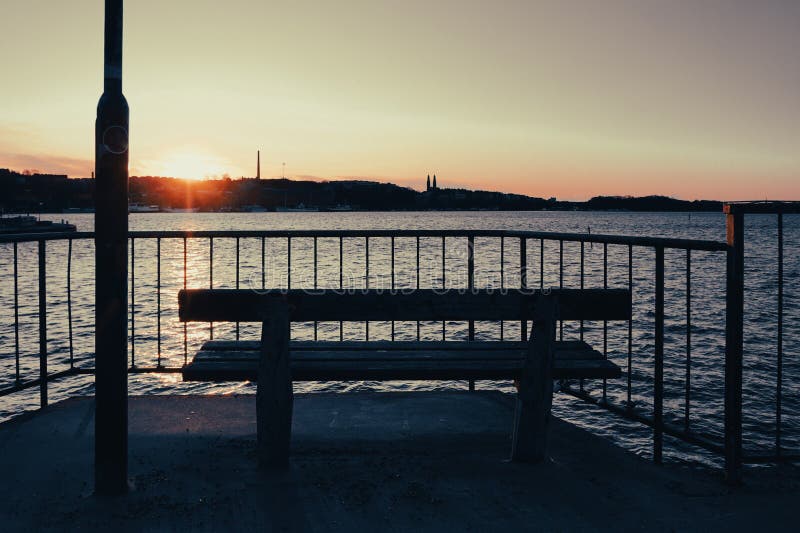A bench at a railing stock image. Image of orange, park - 372600117