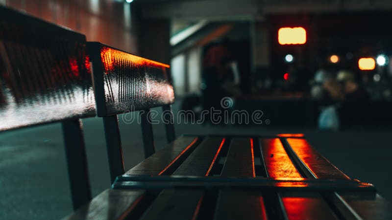Bench Reflection Night Lights. Red Lights in the Background Bokeh ...