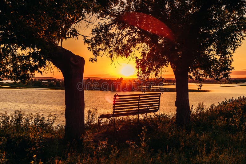 Bench by the River. stock image. Image of retirement - 122347857