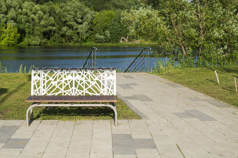 Bench Near the River with a Concrete Path. Stock Photo - Image of peace ...