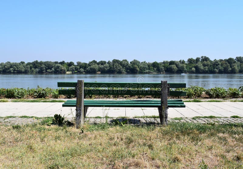 A bench by the river stock image. Image of relax, danube - 96053041