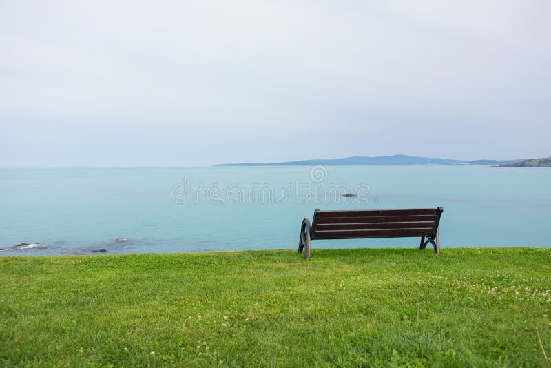Bench at the Sea stock photo. Image of ocean, horizon - 95132640