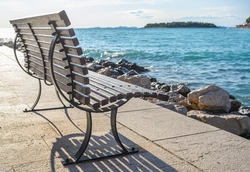 Bench on the seashore. stock photo. Image of landscape - 288196032