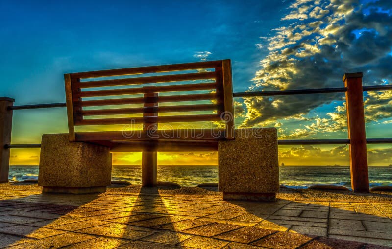 Bench at the seaside stock image. Image of bench, clouds - 52202549