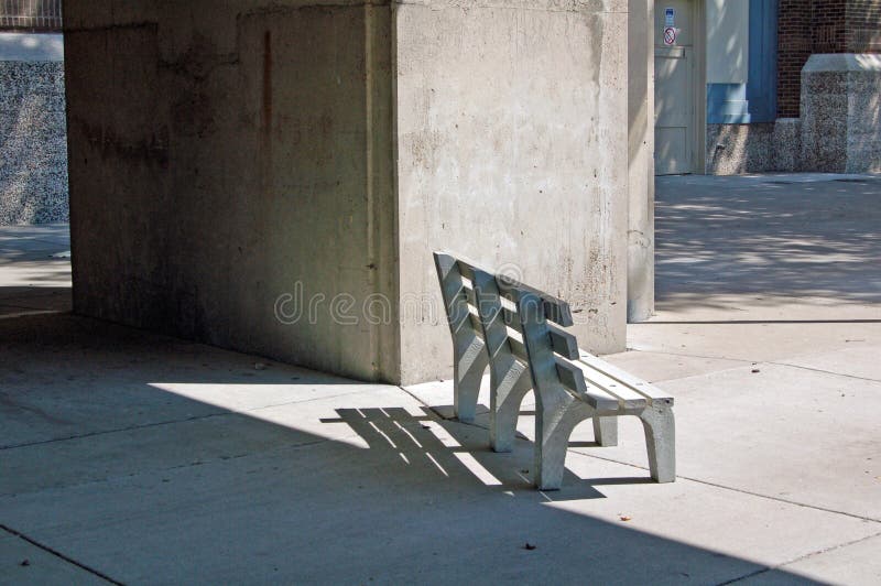 Bench in shadows stock image. Image of cement, light, sidewalk - 1004287