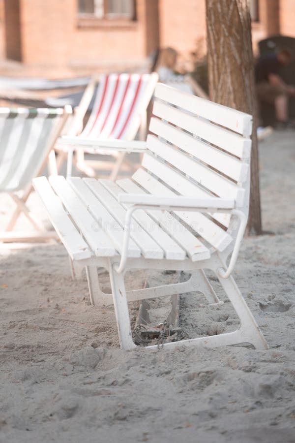 Bench Standing in the Sand at the Beach in the Shadow, on a Very Sunny ...