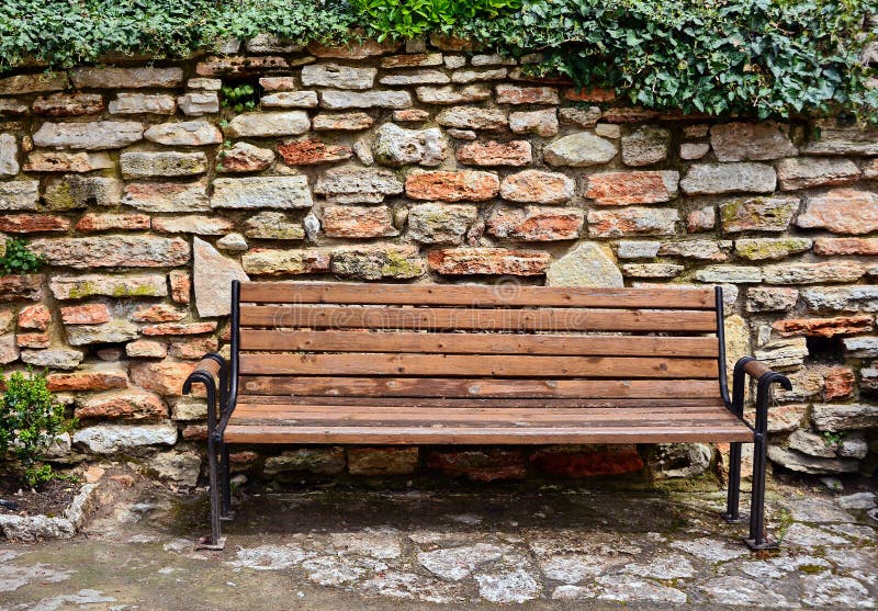 Bench and stone wall stock photo. Image of design, seat - 53400330
