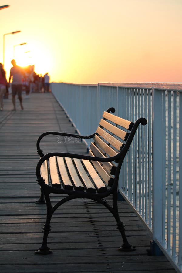 Bench at sunrise stock photo. Image of adult, people - 58850018
