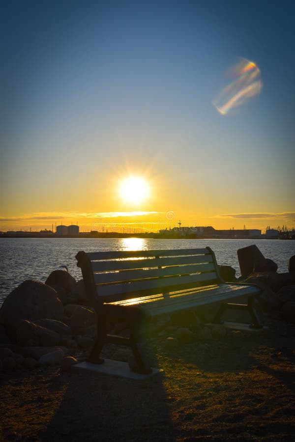 Bench at Sunrise by the Water Stock Photo - Image of ventspils, sunrise ...