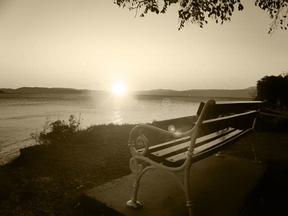 Bench on sunset stock photo. Image of looking, ocean - 13061578