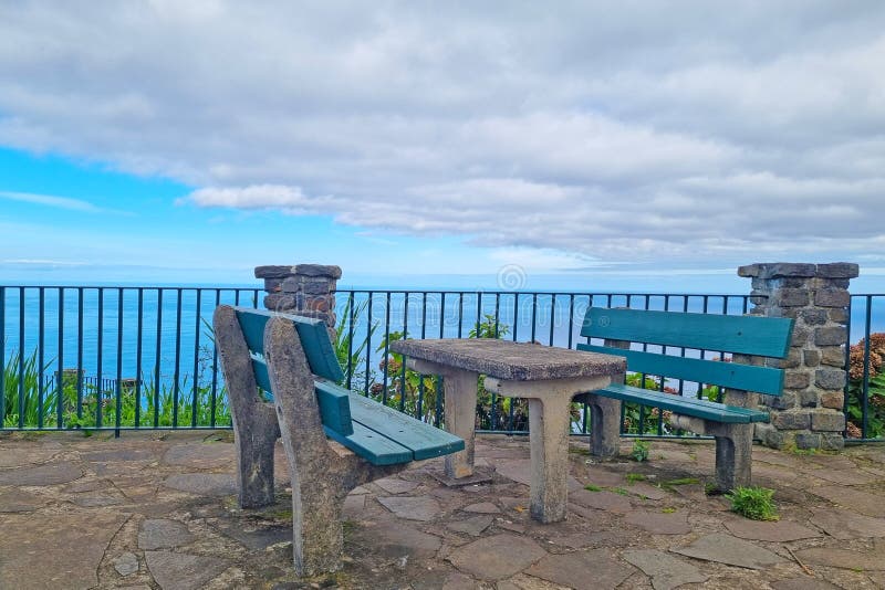 A Bench and a Table with a Beautiful View of the Ocean. Stock Image ...