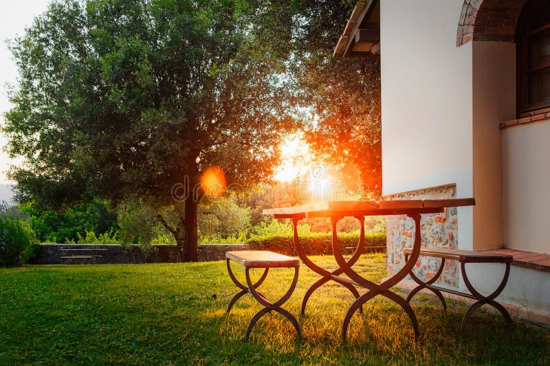 Bench and Table in Nature with Bright Sun at Sunset Stock Image - Image ...