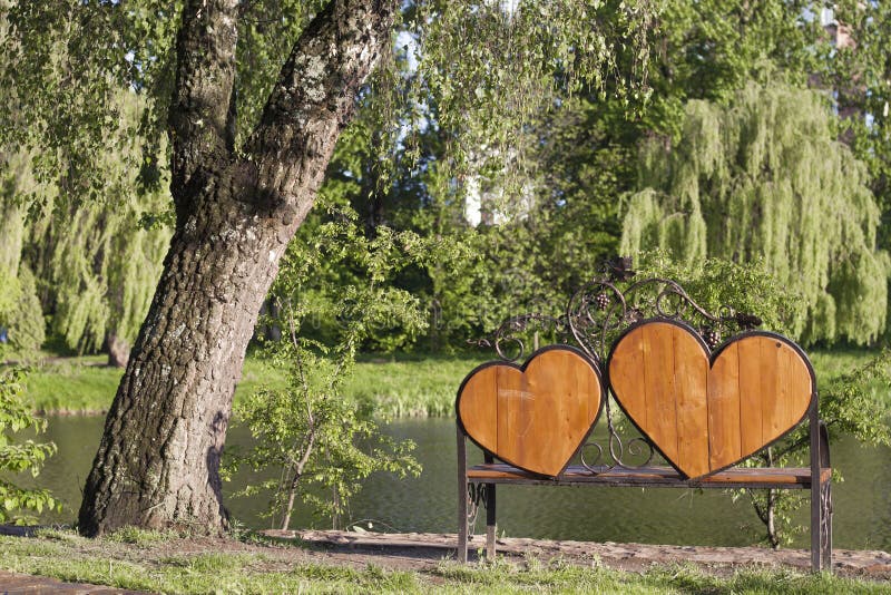 A Bench with Two Hearts on it for Couples in Love Stock Image - Image ...