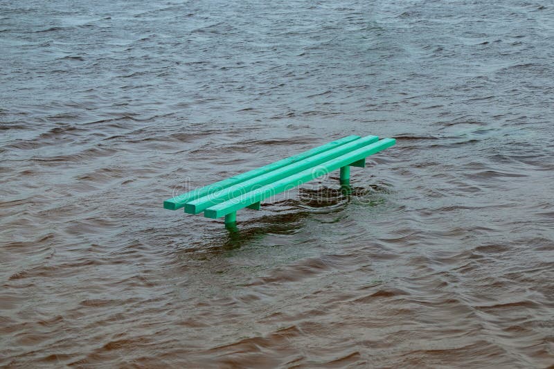 Bench is in the Water. Beach or Park Flooded Stock Image - Image of ...