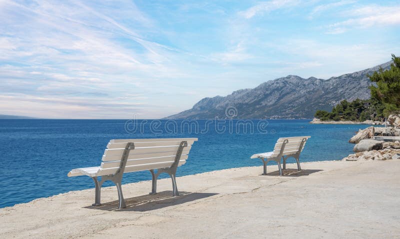 Bench on the Waterfront Overlooking the Sea. Stock Image - Image of ...