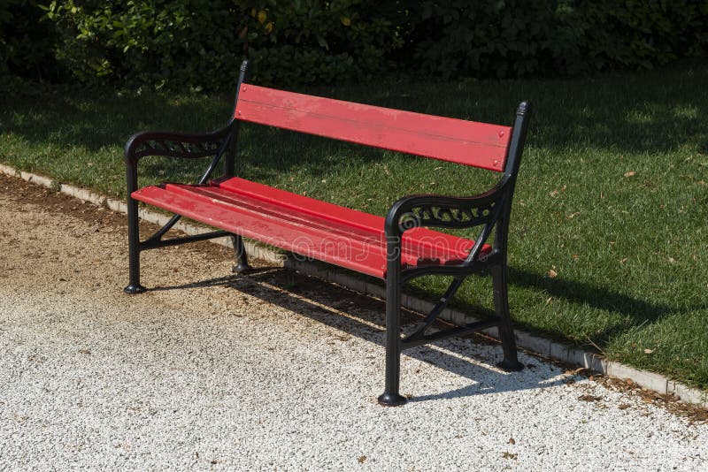 Bench in Wrought Iron and Red Painted Wood Stock Image - Image of iron ...