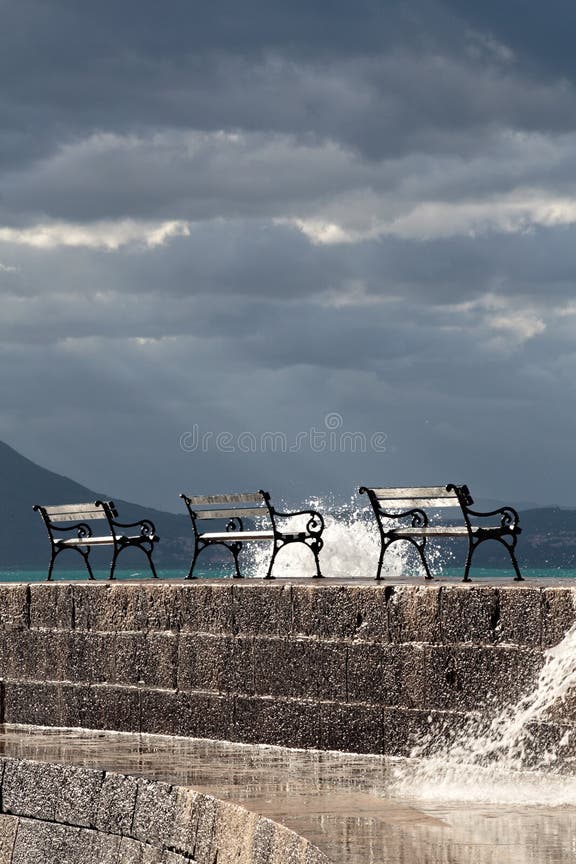Benches with a Dark Sky with Rays of Sunshine Stock Photo - Image of ...