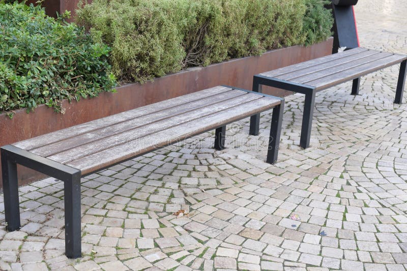 Benches Placed Along a Cobblestone Pathway in a Park Setting Stock ...