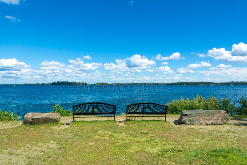 Benches on the river stock image. Image of lawrence - 128482425