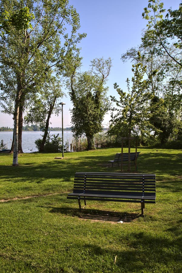Benches by the Shore of a Lake in a Park in an Italian Town Stock Image ...