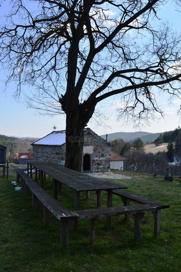Benches and a Table in Front of an Old Small, Stone Orthodox Church ...