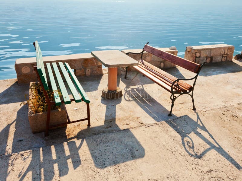 Benches on the waterfront stock photo. Image of lounge - 82216794