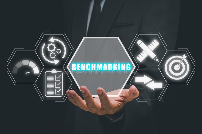 Businessman Hand Holding Benchmarking Icon on Virtual Screen Stock ...