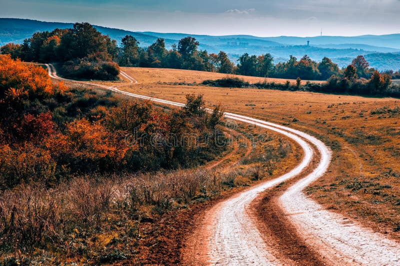 Bending Dirty Road Landscape in Autumn Stock Image - Image of field ...