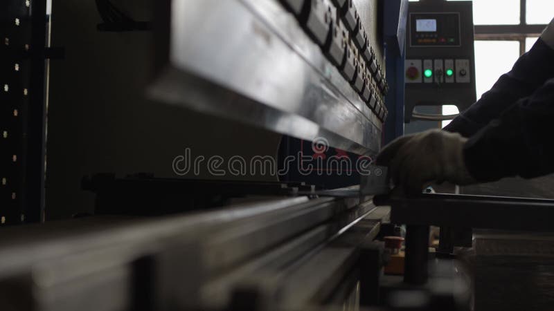 A Bending Machine Operator Bends a Sheet Metal Workpiece on a CNC ...