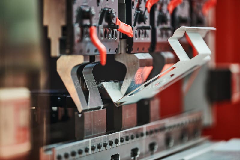 Bending Machine at Work. Process of Metal Sheet Forming Stock Photo ...