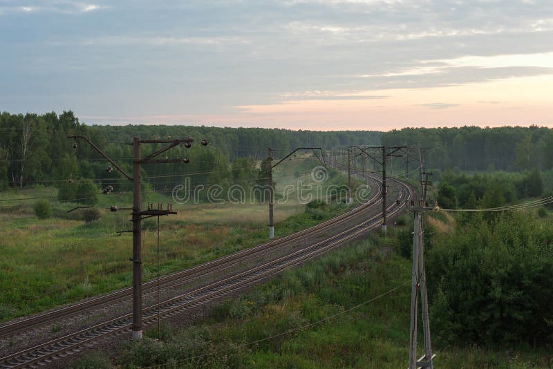 Bending Railroad at Dawn in a Beautiful Forest Stock Image - Image of ...