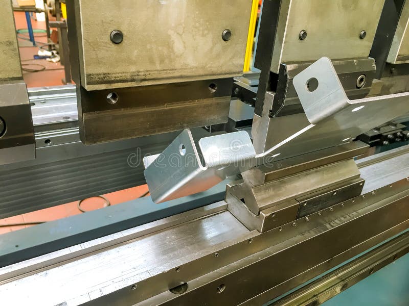 Bending Sheet Metal with a Hydraulic Machine at the Factory Stock Photo ...