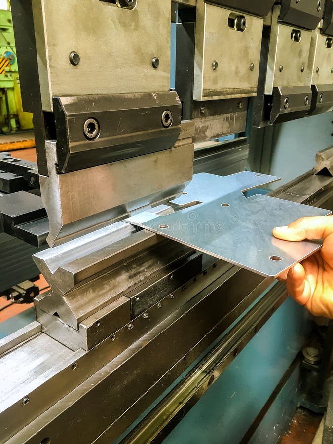 Bending Sheet Metal with a Hydraulic Machine at the Factory Stock Photo ...