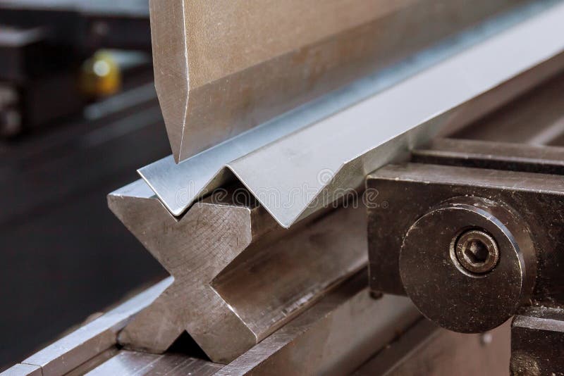 Bending Sheet Metal with a Hydraulic Machine at the Factory Stock Photo ...