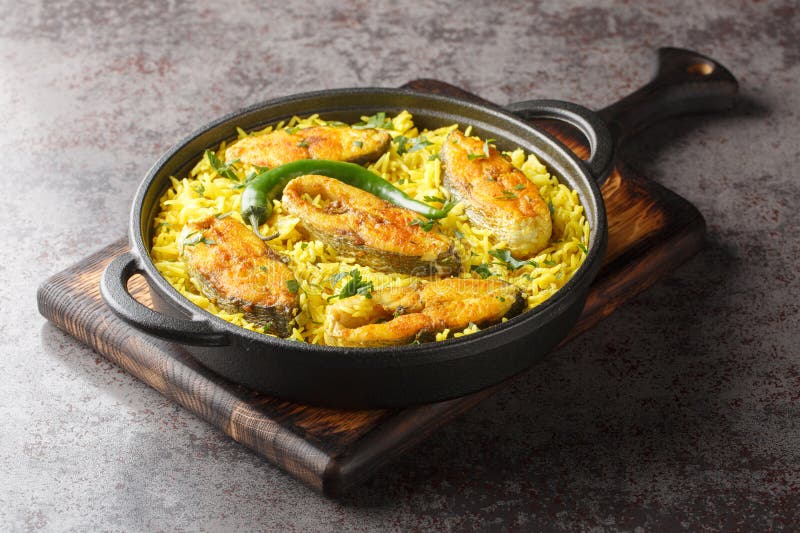 Bengali Style Fish Pilaf Cooked with Ilish Fish Closeup on the Black ...