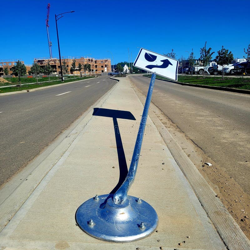 Bent and Twisted Signpost in the Central Median of the Road Stock Image ...