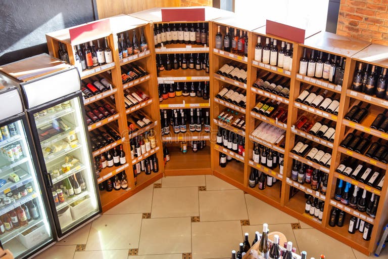 Bottles Withe Alcohol on Store Shelves. Interior of an Alcoholic Shop ...