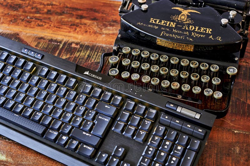 Historic Typewriter and Modern Keyboard that Show the Progress of the ...
