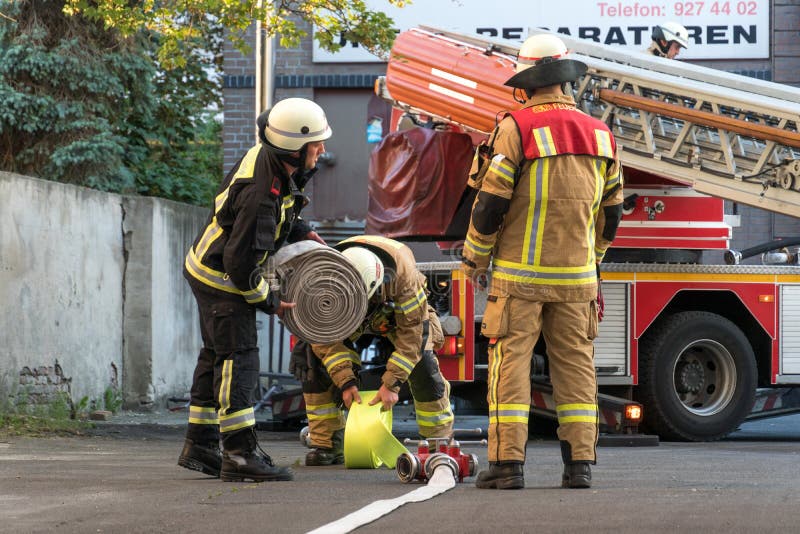 Firefighters in action stock photo. Image of house, group - 14560174
