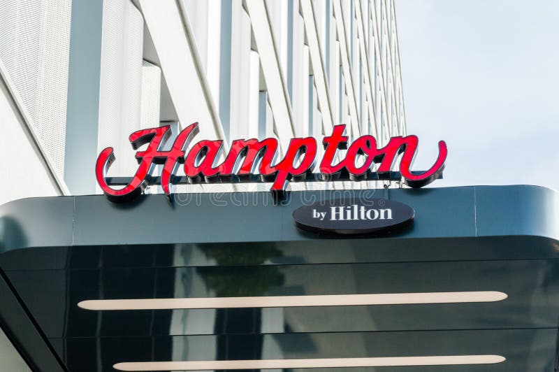 The Hampton by Hilton Logo and Sign. Editorial Photo - Image of sign ...