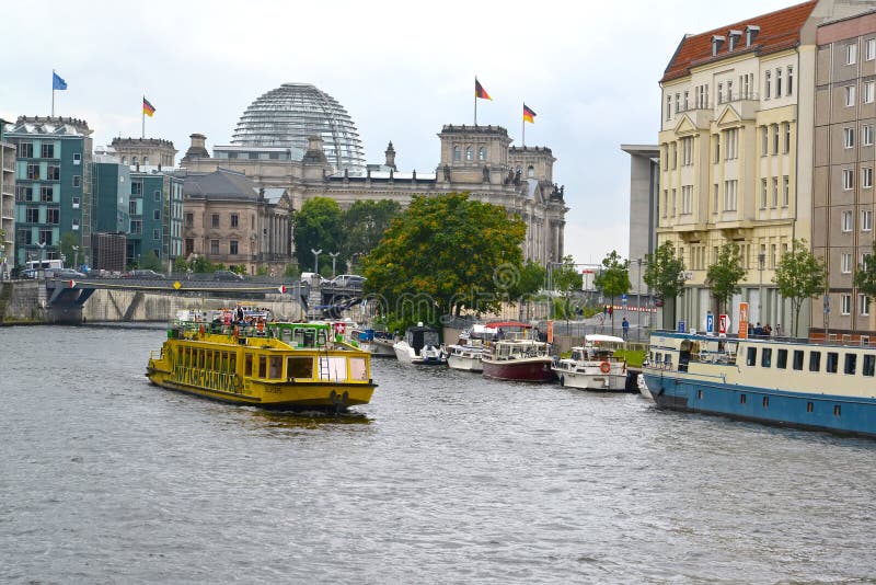BERLIN, GERMANY. the Walking Ships Float Down the River Spree Against ...