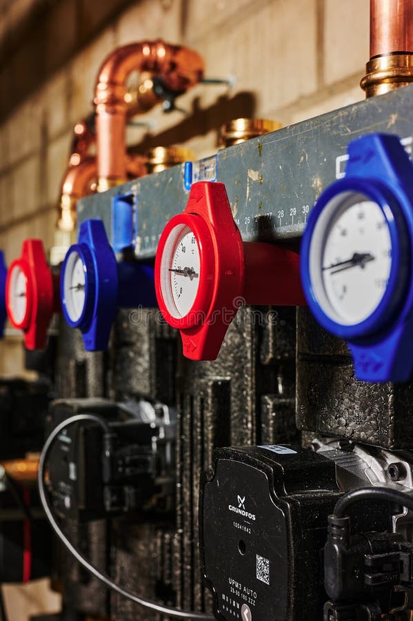 Heating System Under Construction with a View To the Thermometers of ...