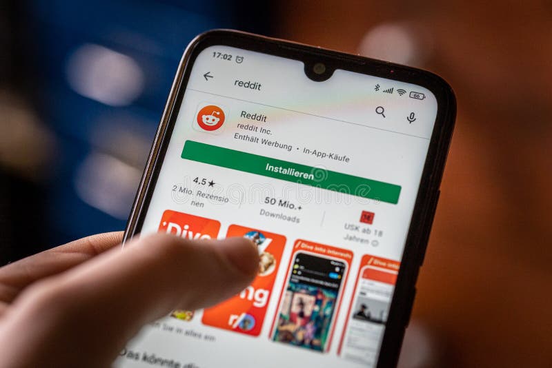 Reddit App is Opened in the Playstore on a German Smartphone. Editorial ...