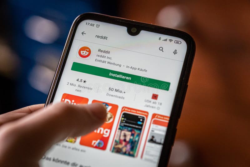 Reddit App is Opened in the Playstore on a German Smartphone. Editorial ...