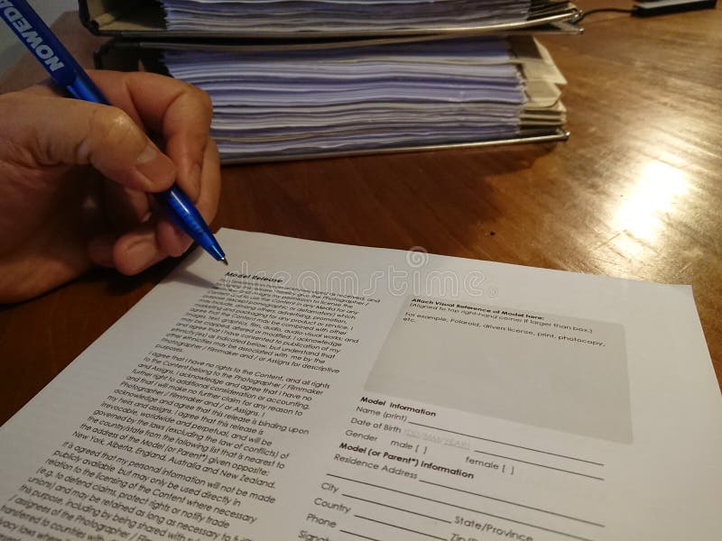 Signing a Model Release Form Editorial Photo - Image of certificate ...