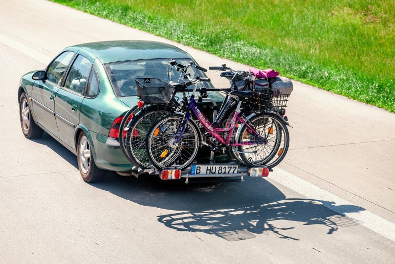 Car is Transporting Bicycles on Rack. Bikes on the Trunk. Stock Photo ...
