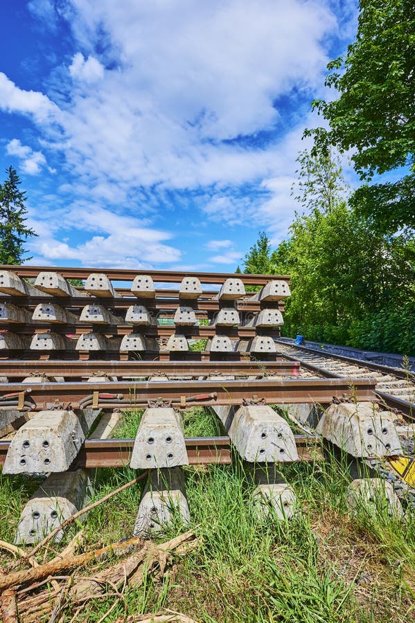 Stack of Concrete Sleepers and Rails on a Construction Site on a ...