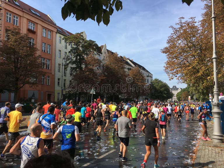 People Running at Berlin Marathon Over Tons of Empty Plastic Cups ...