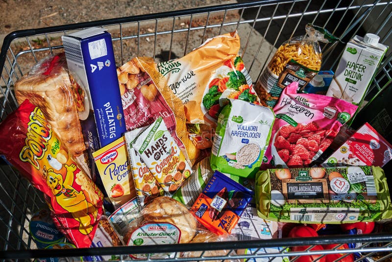 Shopping Cart with Various Products for daily Needs Editorial ...